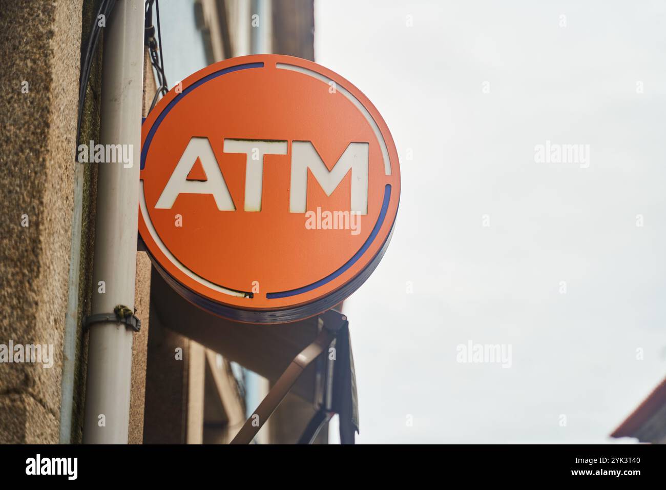 A Sky blue sign with the ATM logo on a metal cylinder Stock Photo - Alamy