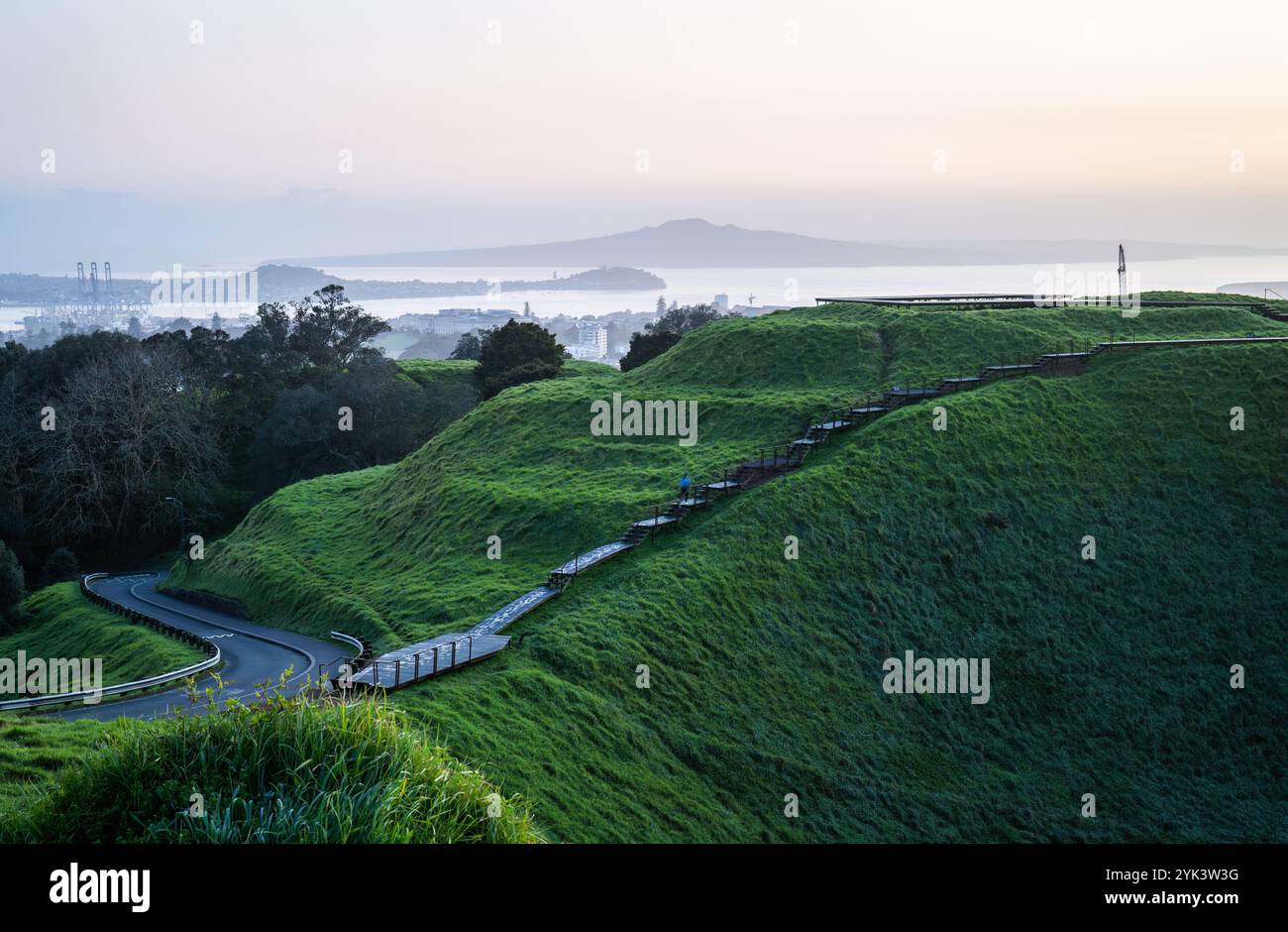 Dawn at Mt Eden summit with the volcanic crater in the foreground ...