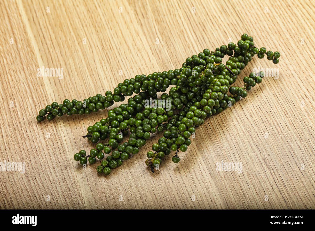 Fresh ripe green peppercon heap isolated Stock Photo - Alamy