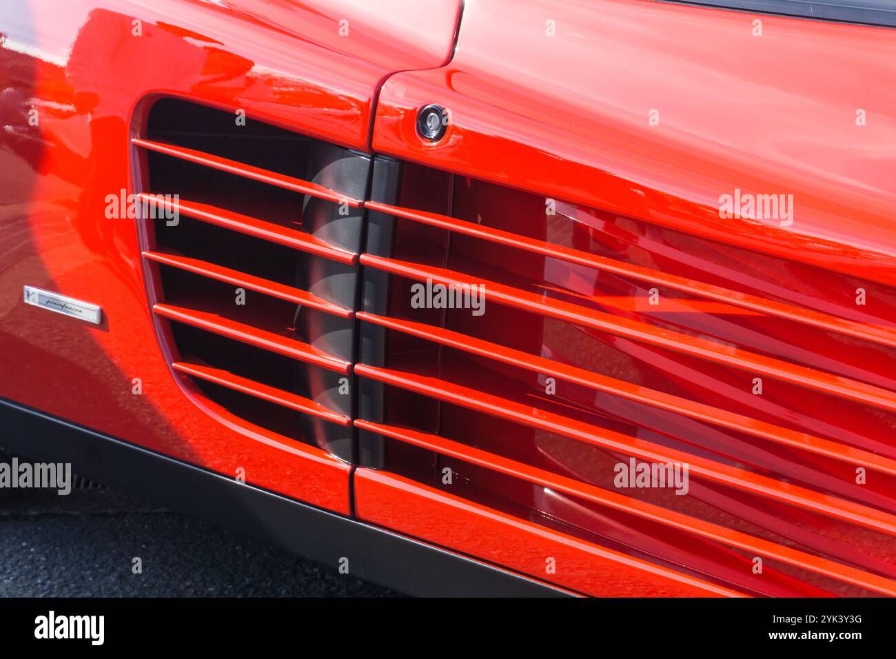Close up detail of the side strake air intakes on a rosso corsa red ...