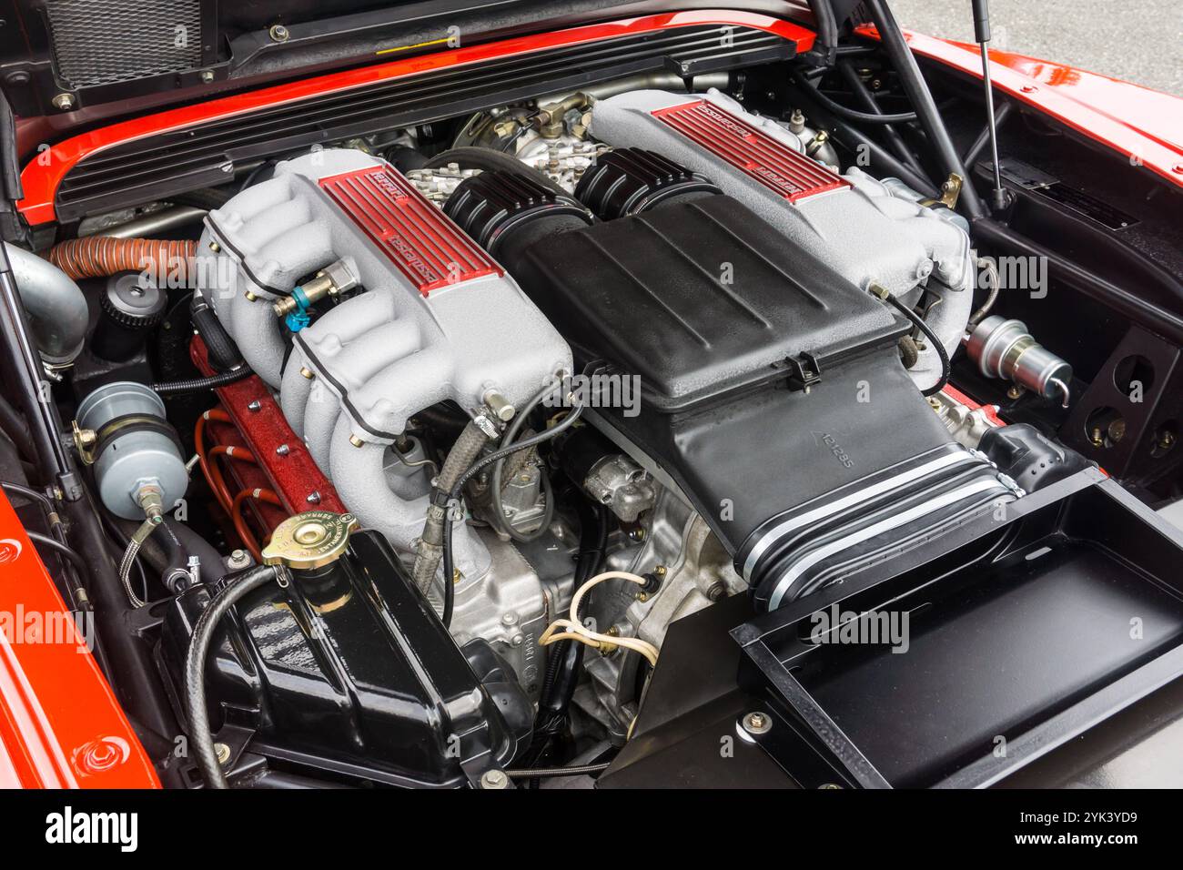 Close up detail of the Tipo F113 flat-12 engine in a rosso corsa red ...