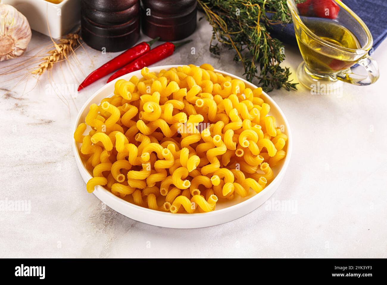 Italian cuisine - dry cellentani pasta for cooking Stock Photo - Alamy