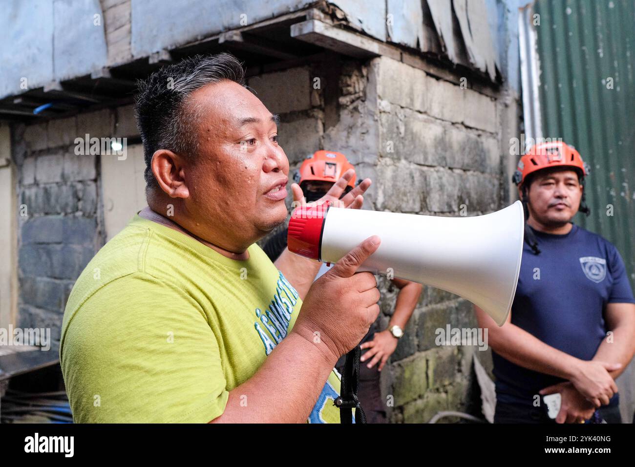 Super Typhoon Man-Yi In The Philippines Village officials and personnel from the Quezon City ...