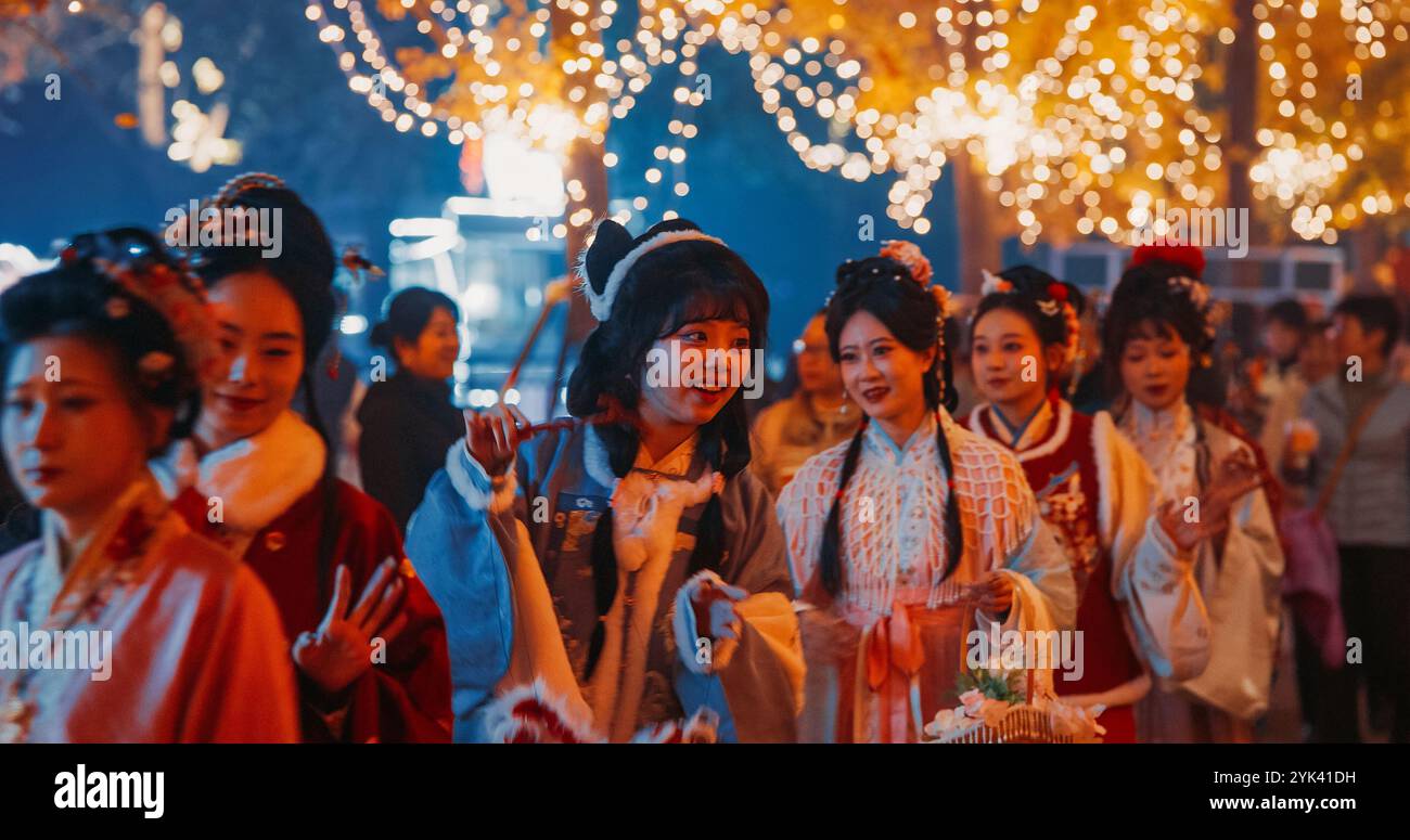 Beijing, China. Pretty Women In Traditional Chinese Dresses Walking At ...