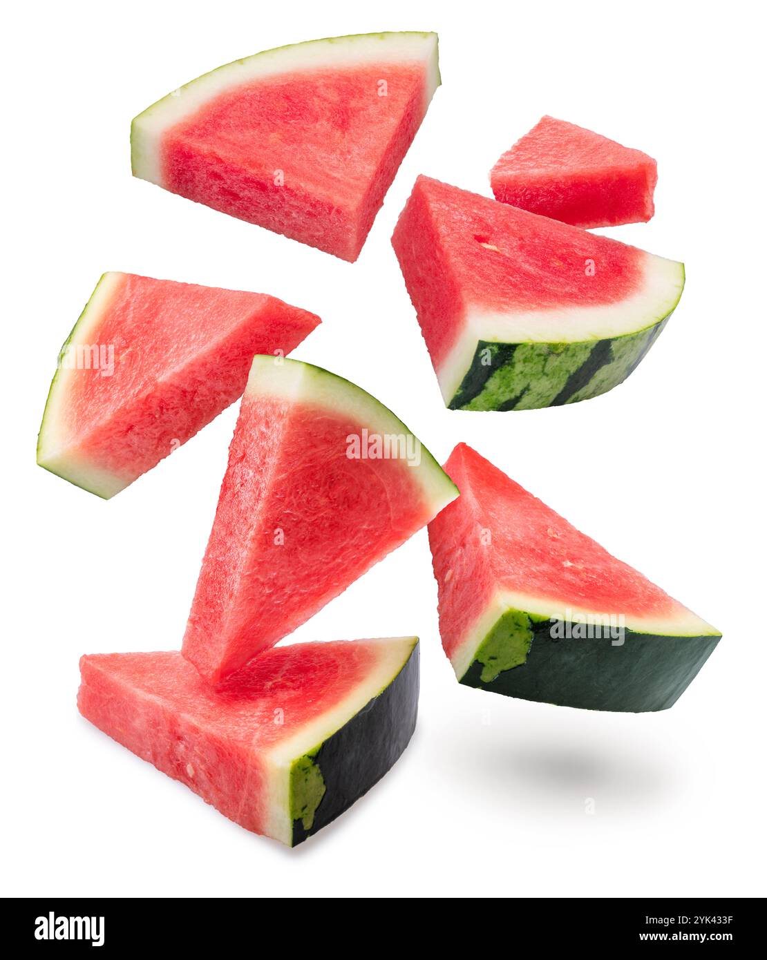 Watermelon slices falling down isolated on white background. File ...