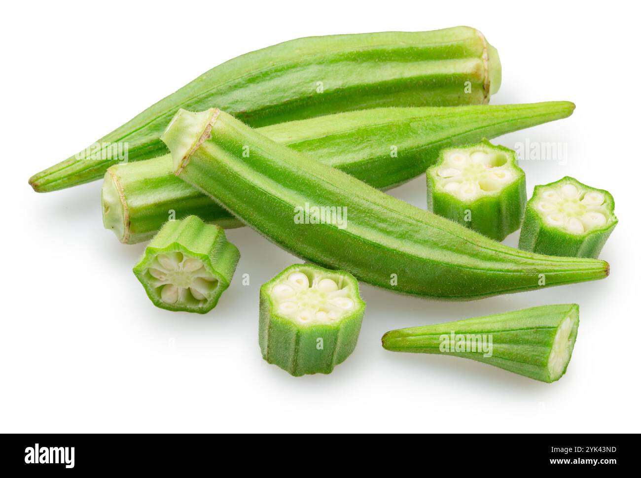 Okra green seed pods, and pieces of okra isolated on white background ...