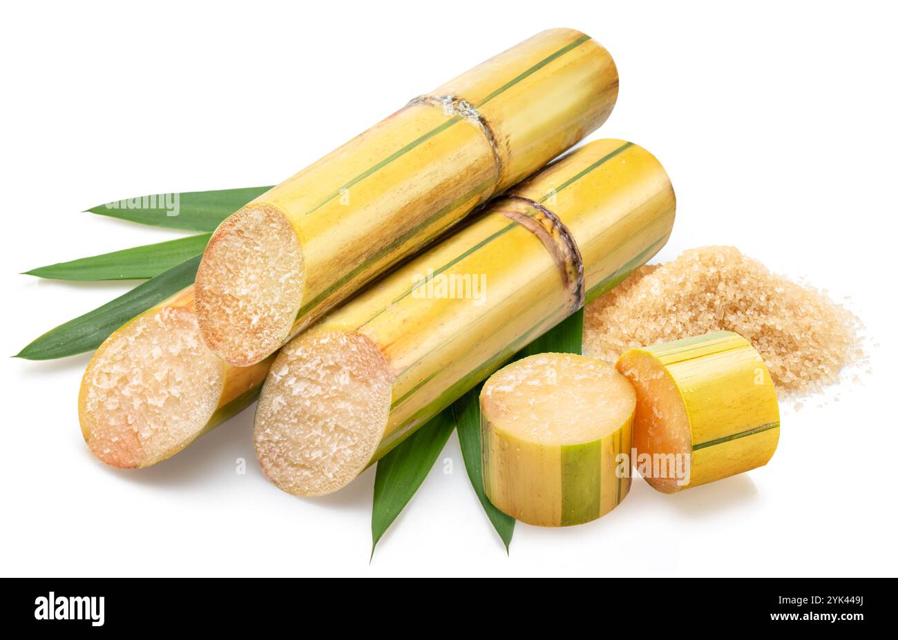 Sugarcanes stalks with sugar cane leaves and pile of sugar isolated on ...
