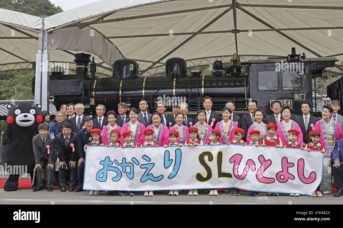 Hitoyoshi, Japan. 17th Nov 2024. People pose for a photo in front of ...
