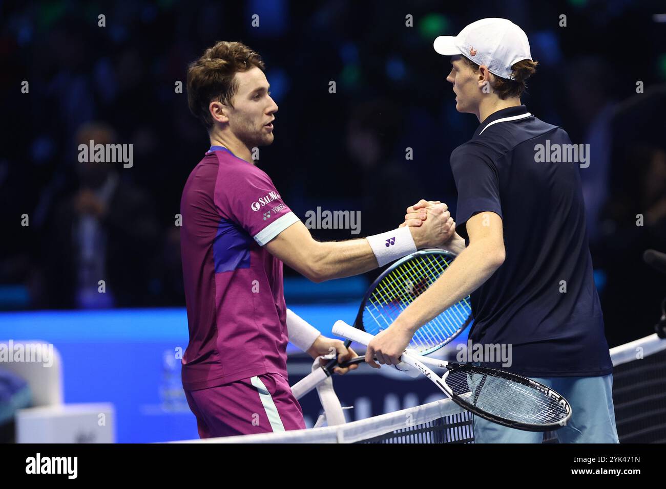 Turin, Italy. 16th Nov, 2024. Jannik Sinner of Italy (L) shakes hand with Casper Ruud of Norway ...