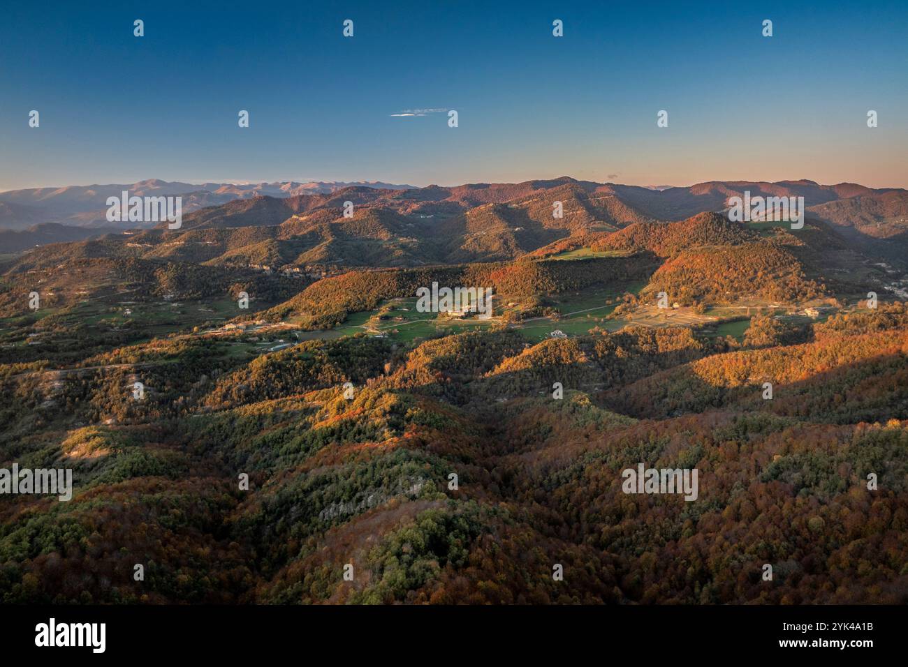 Aerial view of Bisaura and the Vidrà valley on an autumn sunset (Osona ...