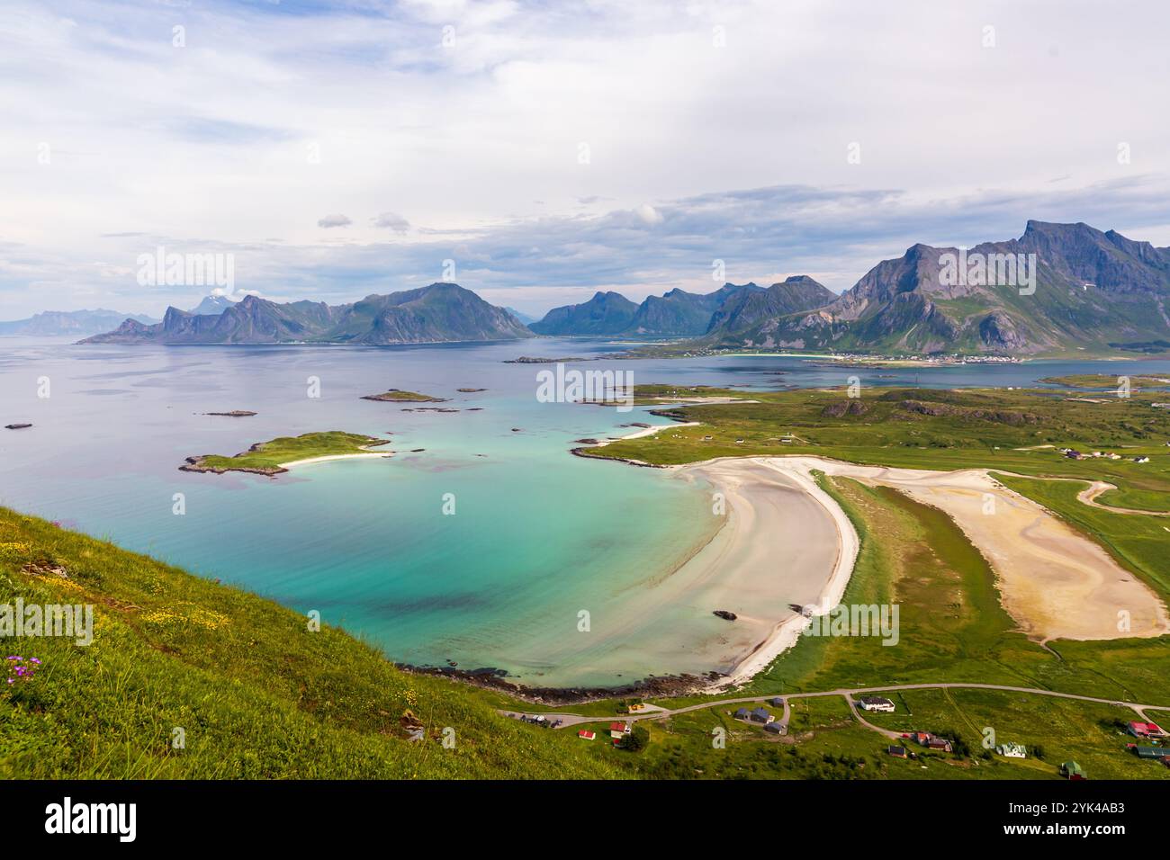 A breathtaking view of a Lofoten beach taken from a height, with dramatic mountains and ...
