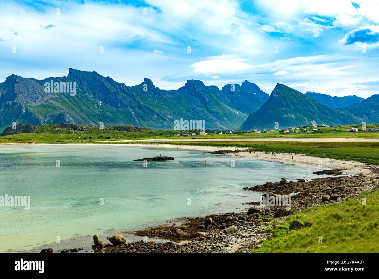 A breathtaking view of a Lofoten beach taken from a height, with dramatic mountains and ...