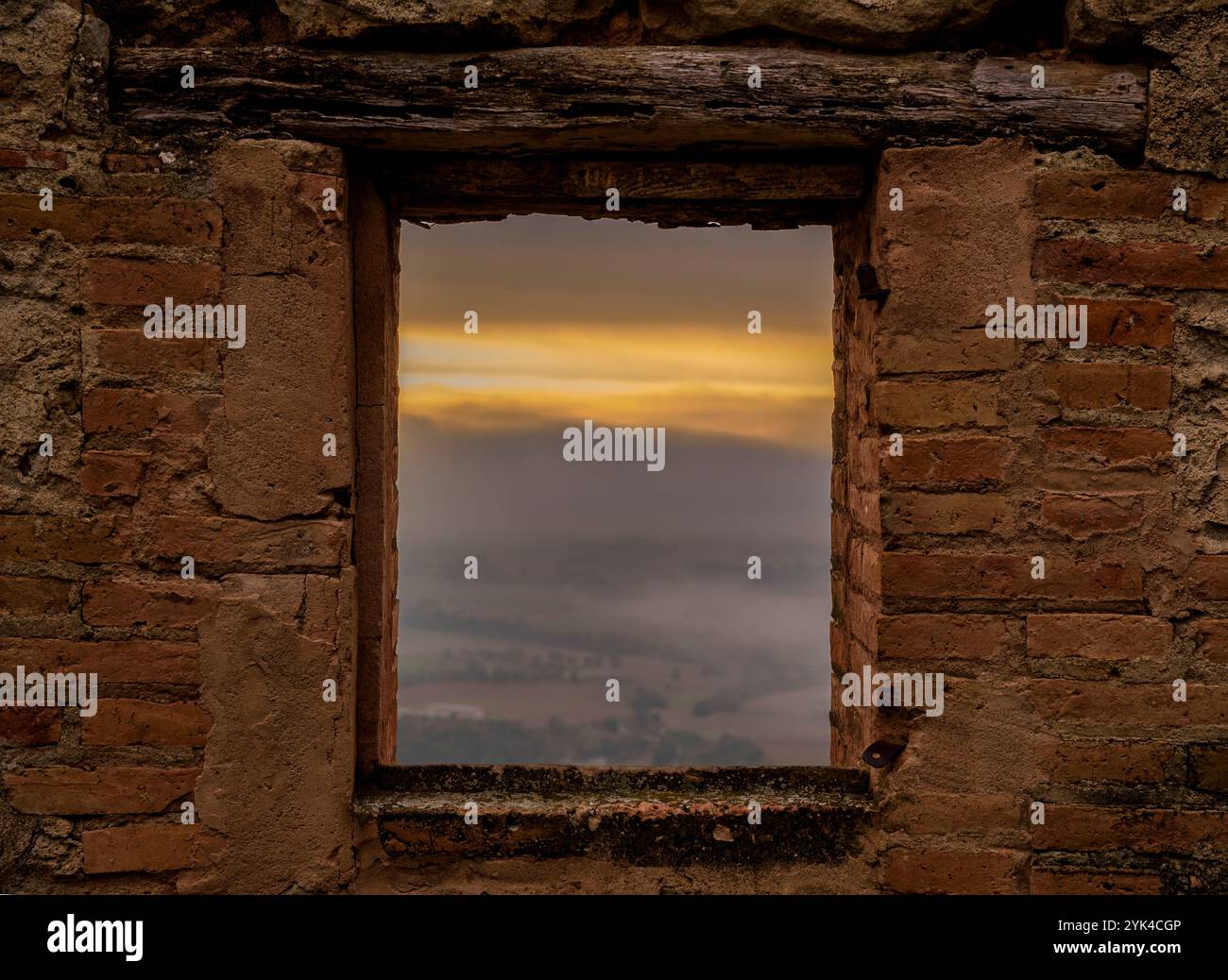 View of the Plana de Vic plain at sunrise through a window of the Sant ...