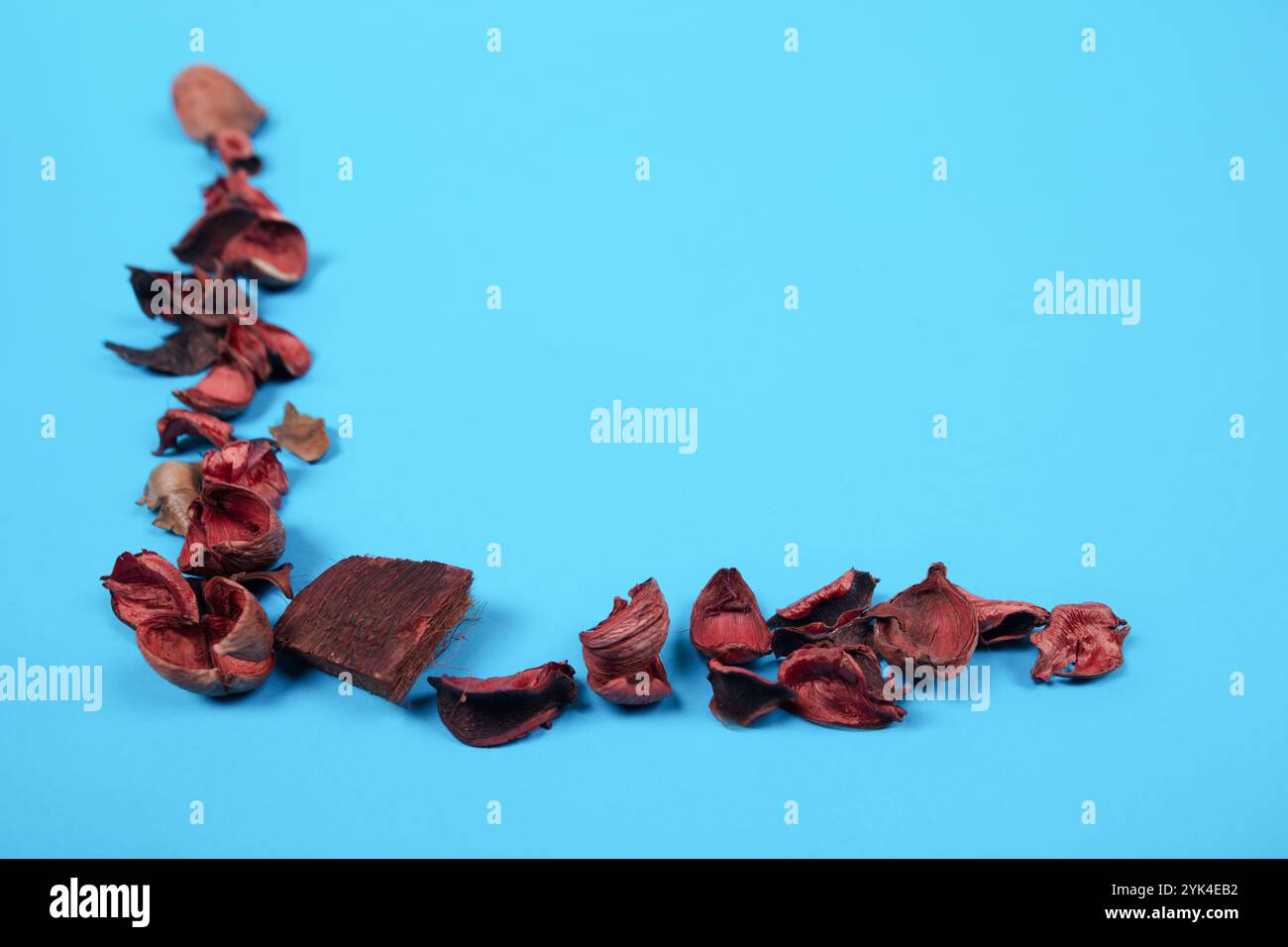 Minimalist Composition of Red Potpourri on Blue Background in L-Shape ...