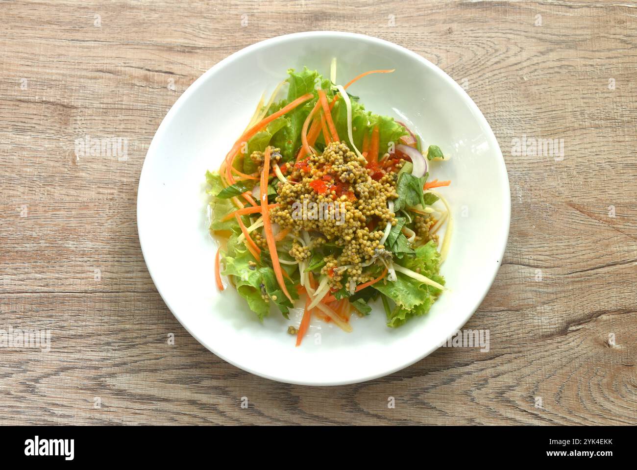spicy and sour sea horseshoe crab egg wiith slice vegetable salad Thai ...