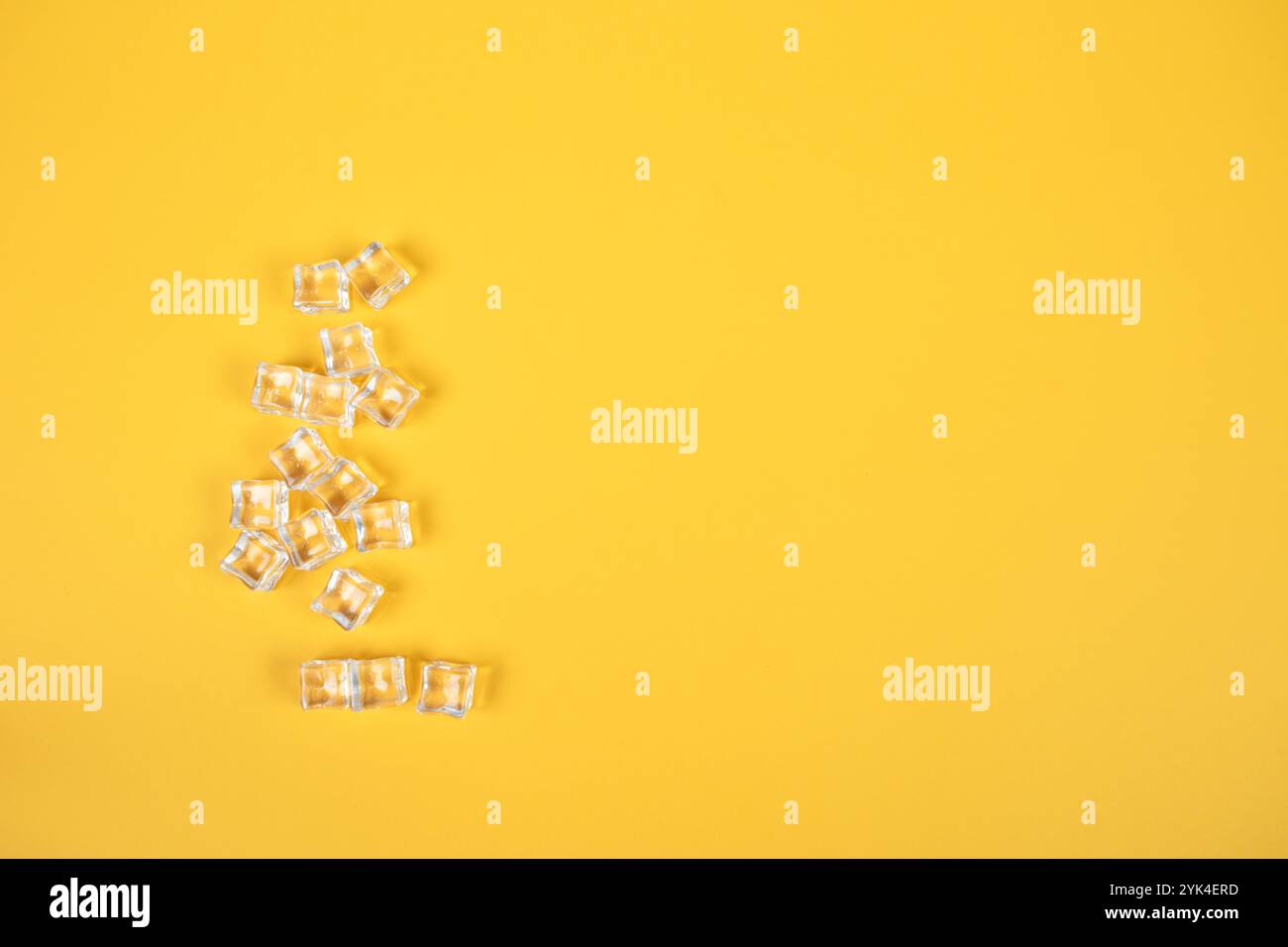 Crystal Clear Ice Cubes Stacked on Vibrant Yellow Background – Minimalist Design for Refreshment ...