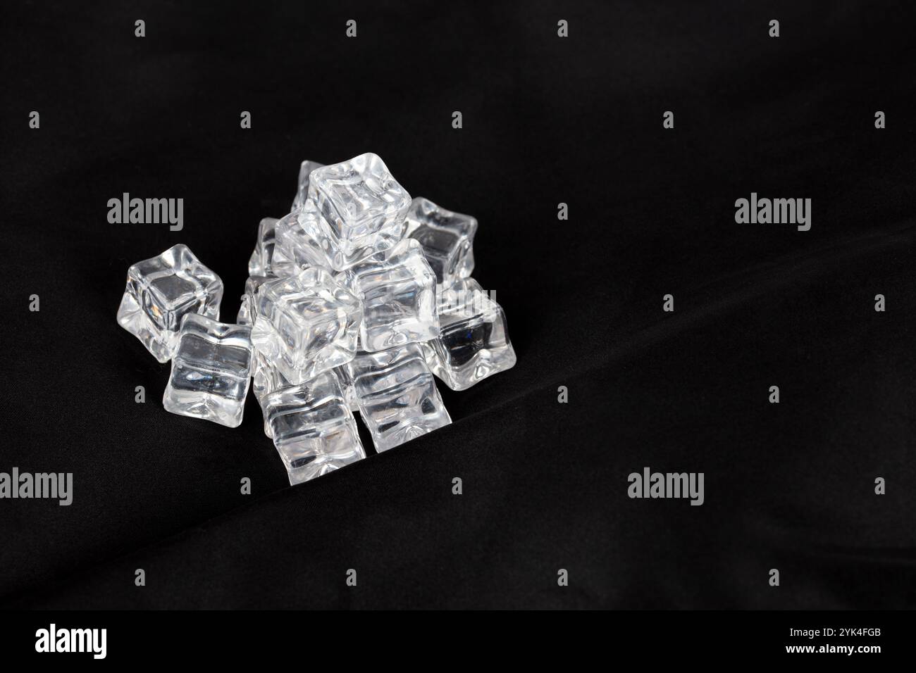 Crystal Clear Ice Cubes Stacked on Vibrant Black Background – Minimalist Design for Refreshment ...