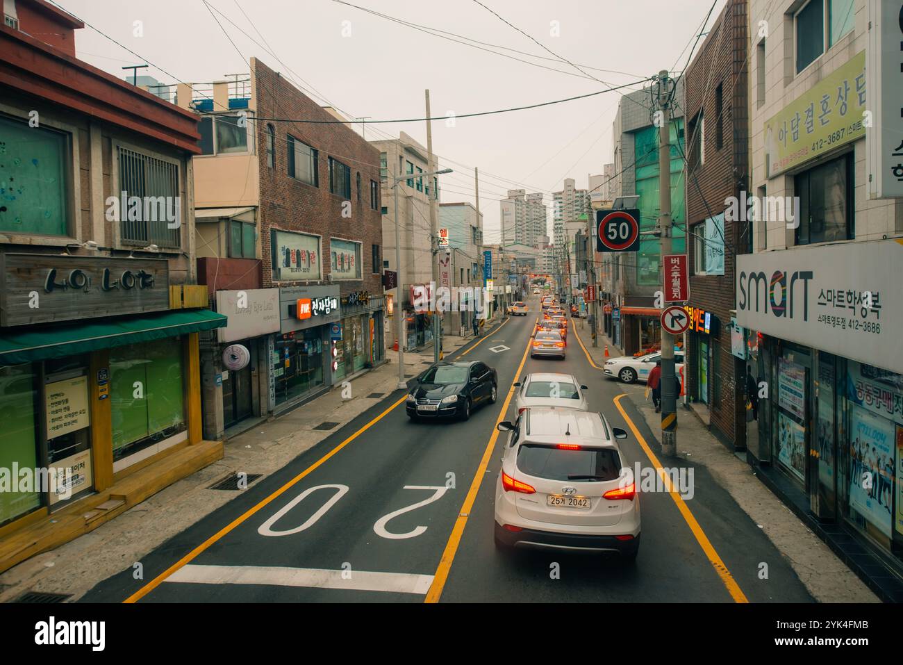Busan, South Korea - May 20th 2023: A street scene in Busan, South Korea, with pedestrians ...