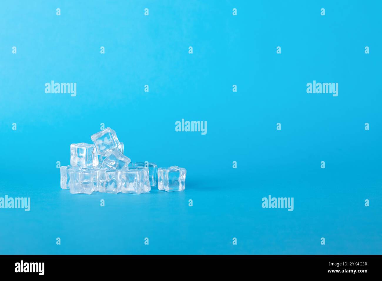Crystal Clear Ice Cubes Stacked on Vibrant Blue Background – Minimalist Design for Refreshment ...