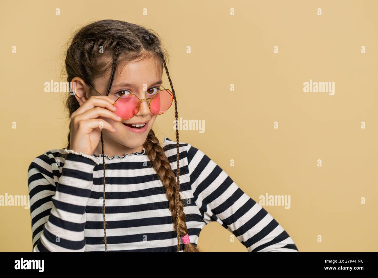 Portrait of happy stylish young preteen child girl kid wearing ...