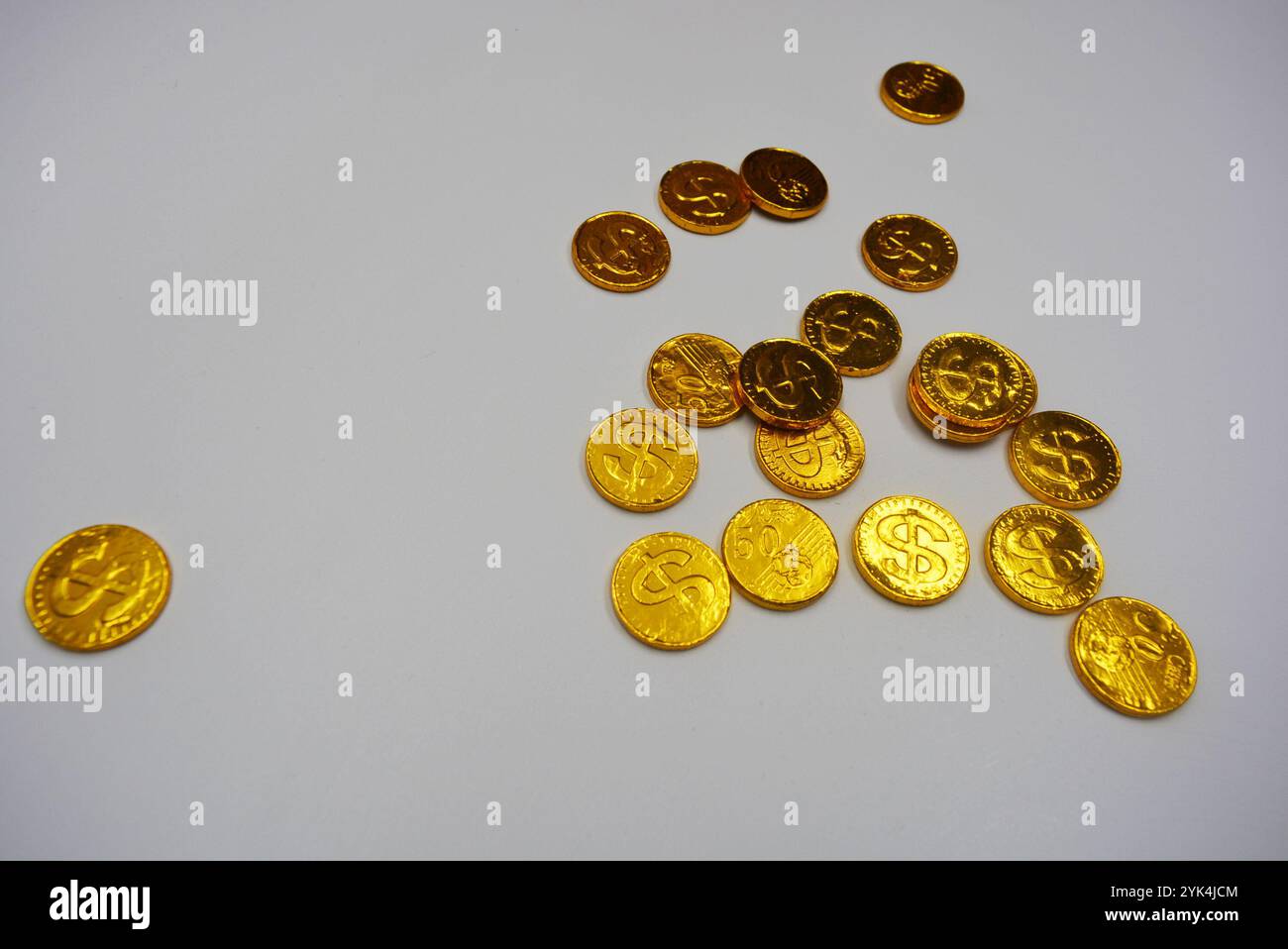 Beautiful, large gold coins, cents with a dollar $ sign are located on ...