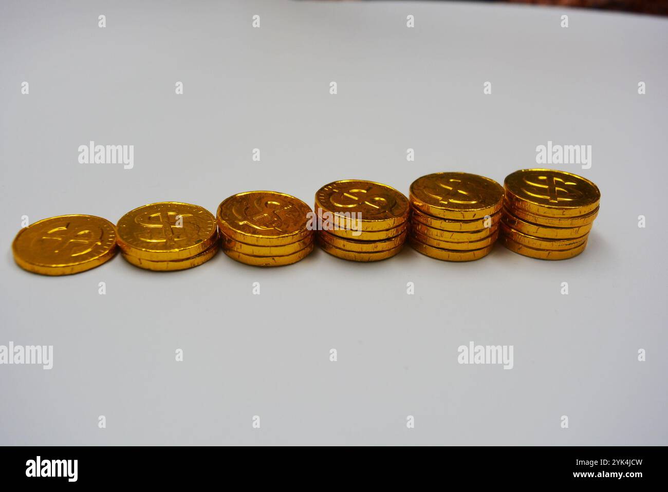 Beautiful, large gold coins, cents with a dollar $ sign are located on ...