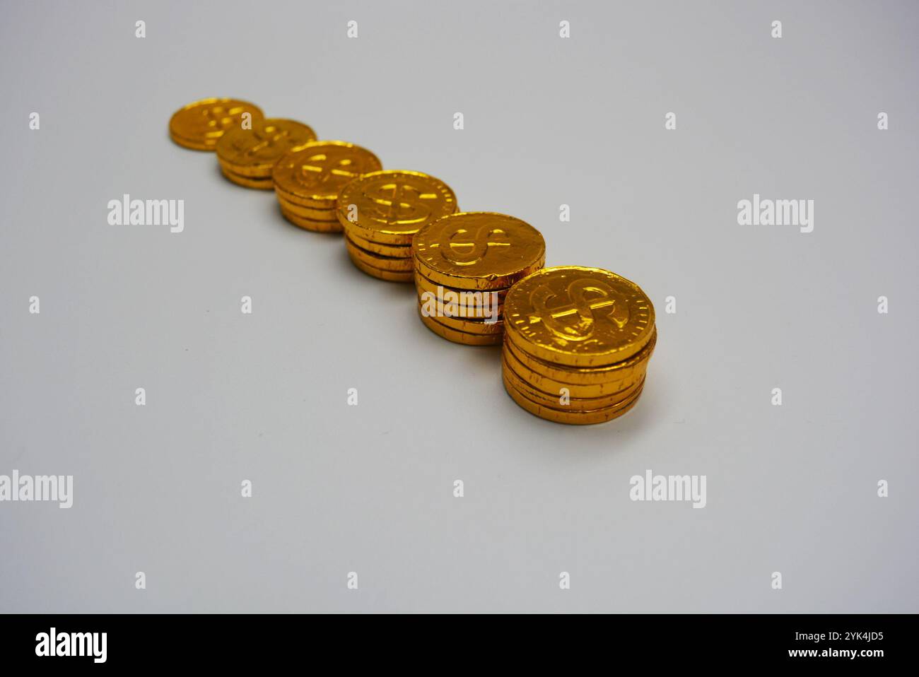 Beautiful, large gold coins, cents with a dollar $ sign are located on ...