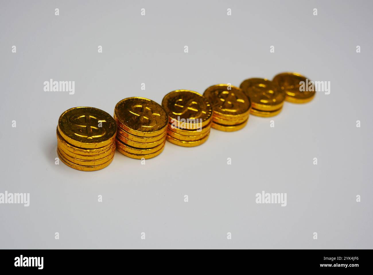 Beautiful, large gold coins, cents with a dollar $ sign are located on ...