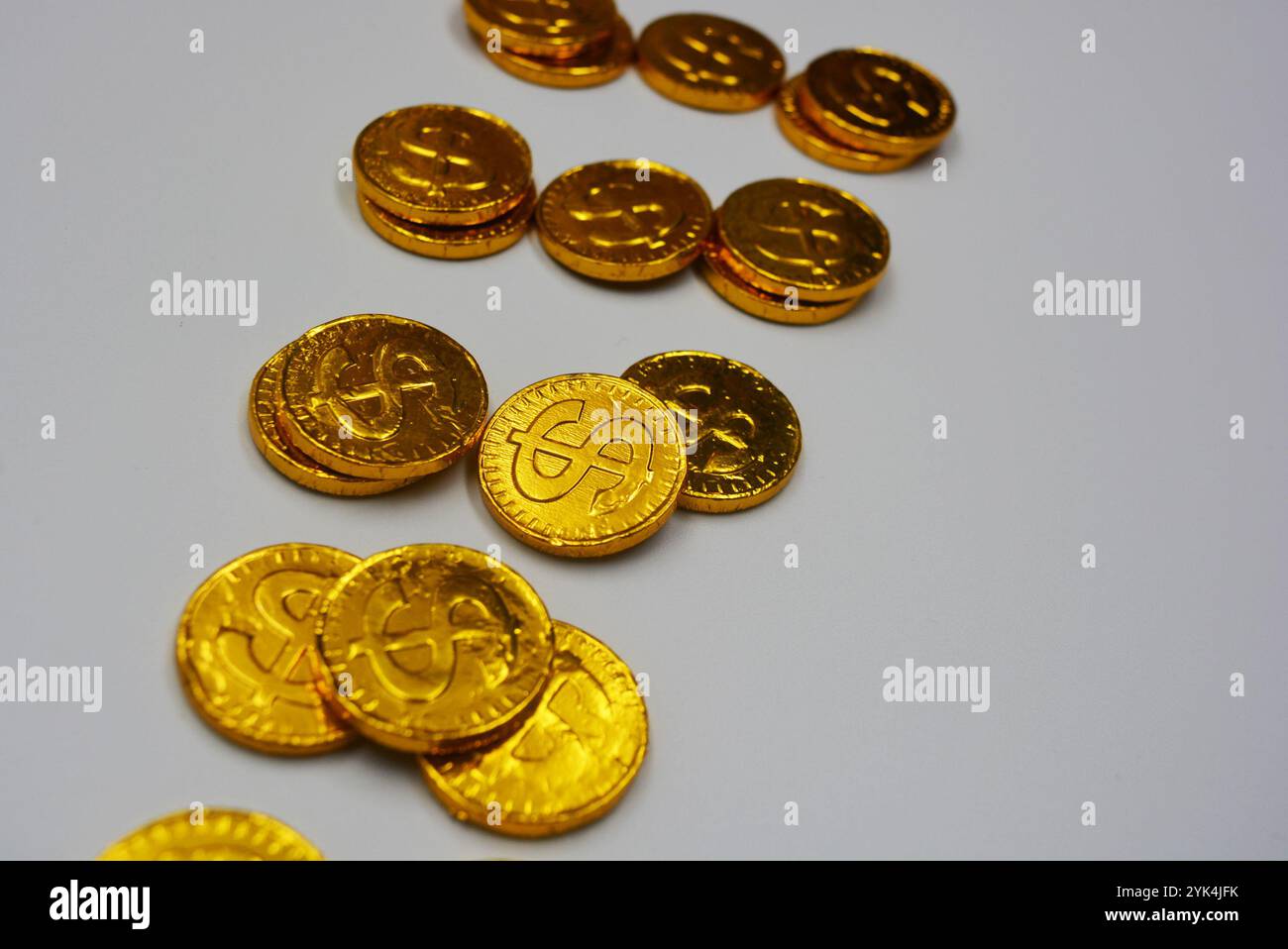 Beautiful, large gold coins, cents with a dollar $ sign are located on ...