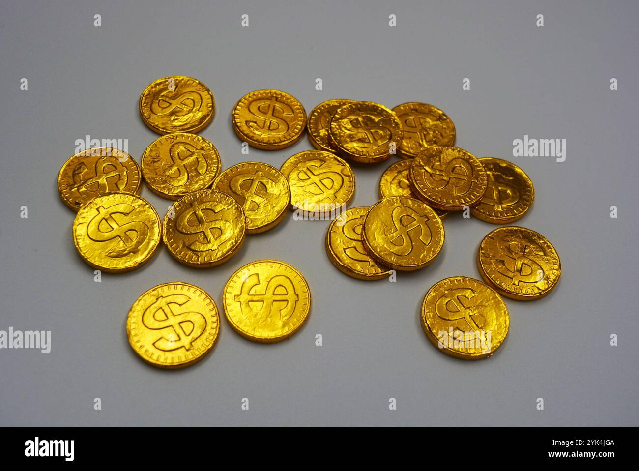 Beautiful, large gold coins, cents with a dollar $ sign are located on ...