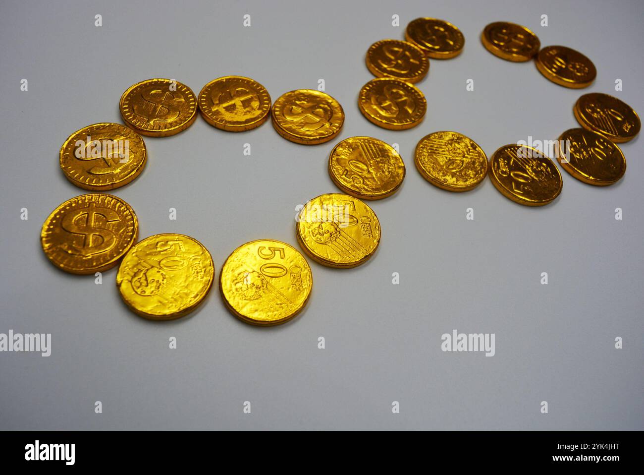 Beautiful, large gold coins, cents with a dollar $ sign are located on ...