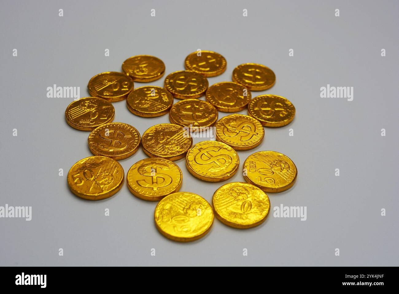Beautiful, large gold coins, cents with a dollar $ sign are located on ...