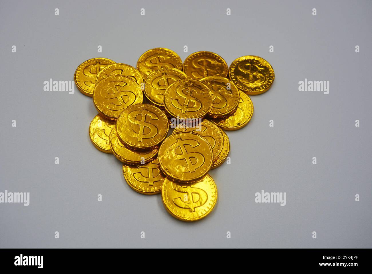 Beautiful, large gold coins, cents with a dollar $ sign are located on ...