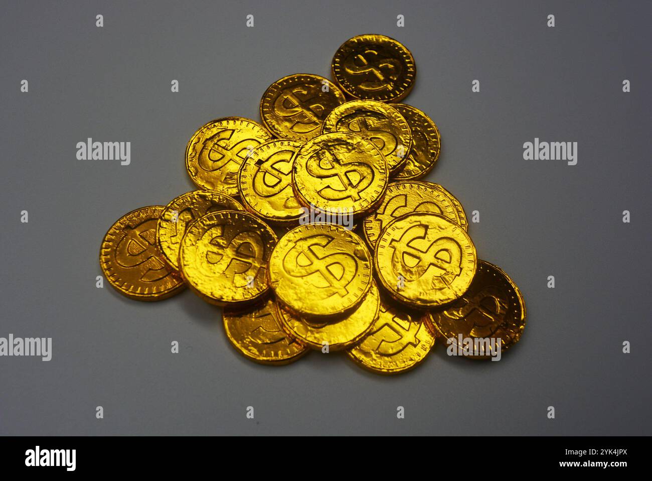 Beautiful, large gold coins, cents with a dollar $ sign are located on ...