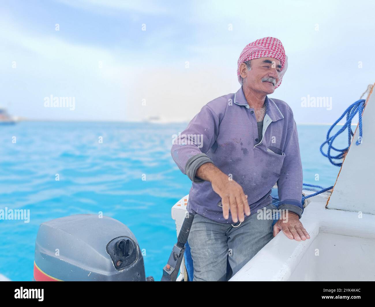 Old Sailor in the Sea Riding and Sailing with his Boat An old sailor ...