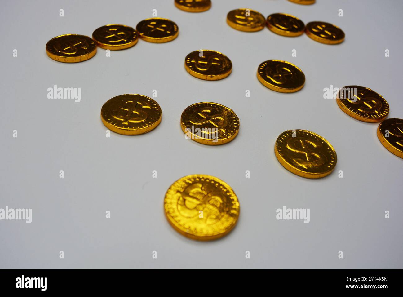 Beautiful, large gold coins, cents with a dollar $ sign are located on ...
