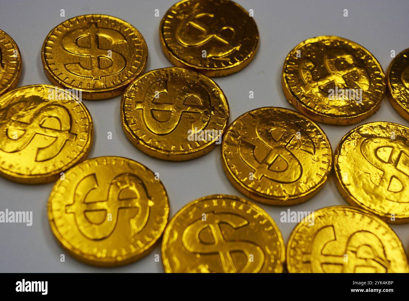 Beautiful, large gold coins, cents with a dollar $ sign are located on ...