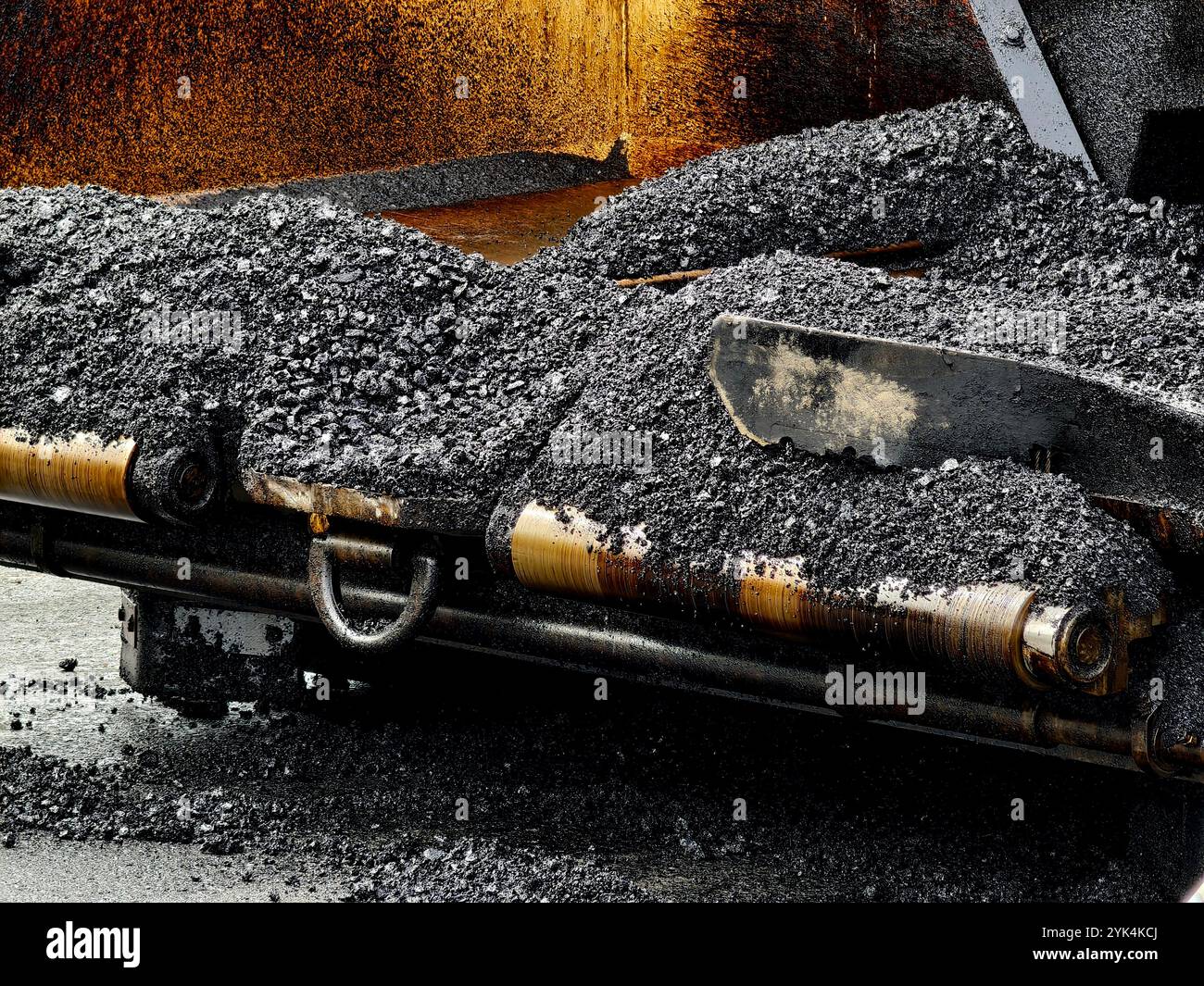 Asphalt paving machine laying down asphalt Stock Photo - Alamy