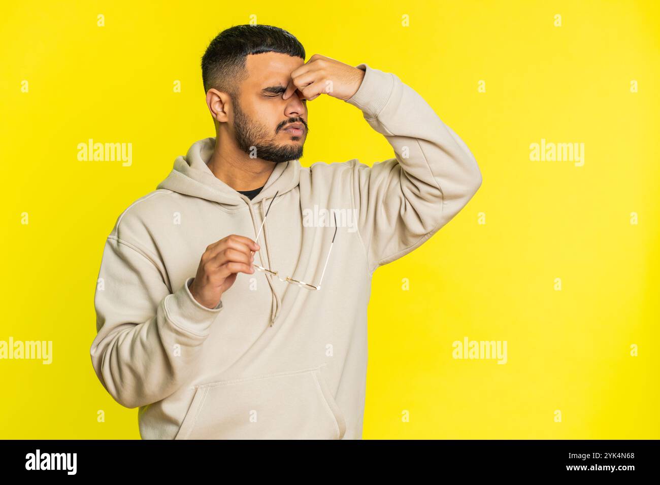 Handsome man feels tired eyes hi-res stock photography and images - Alamy