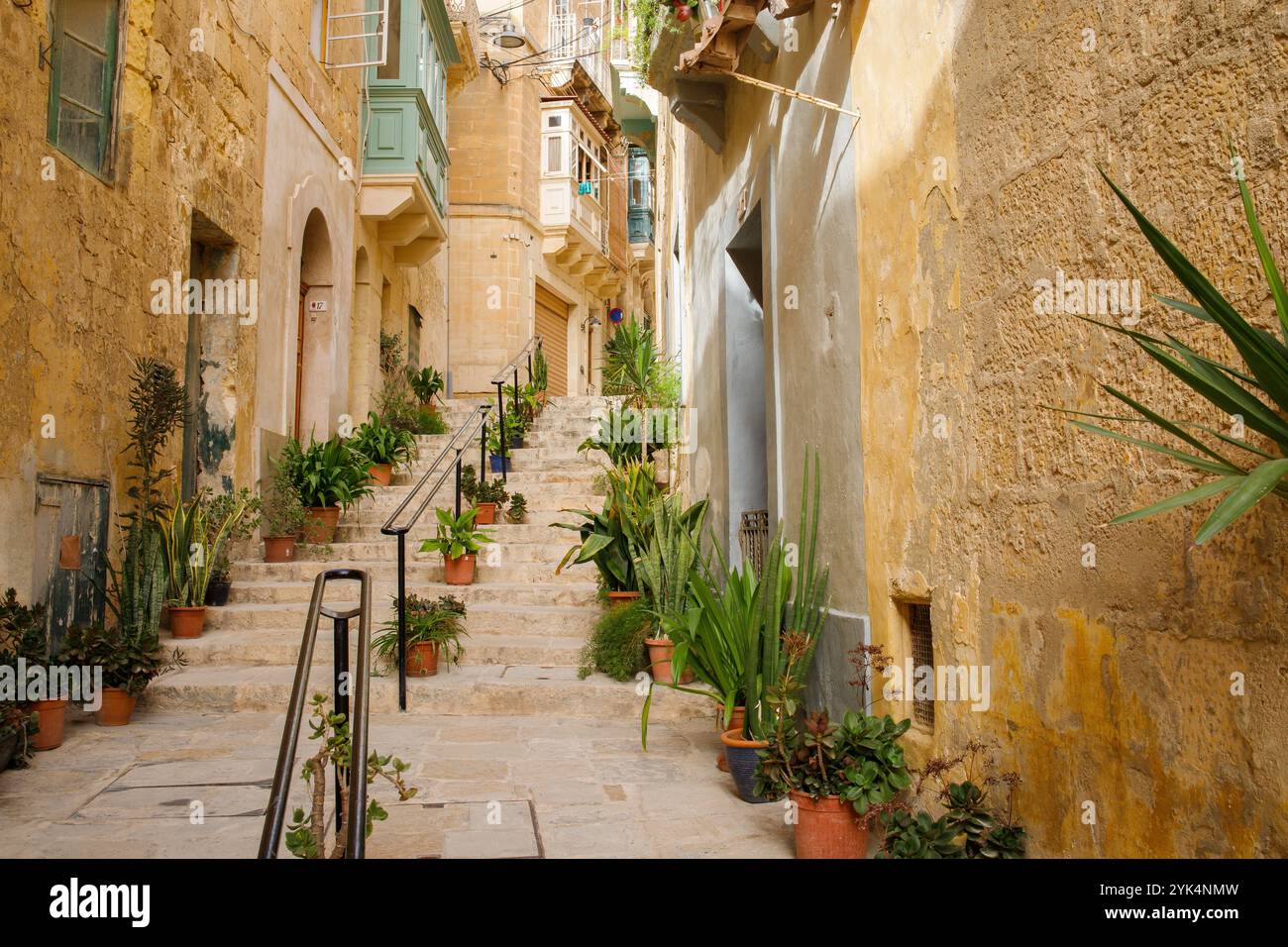 Old stairs with many plant pots in Birgu old town, Malta Stock Photo ...