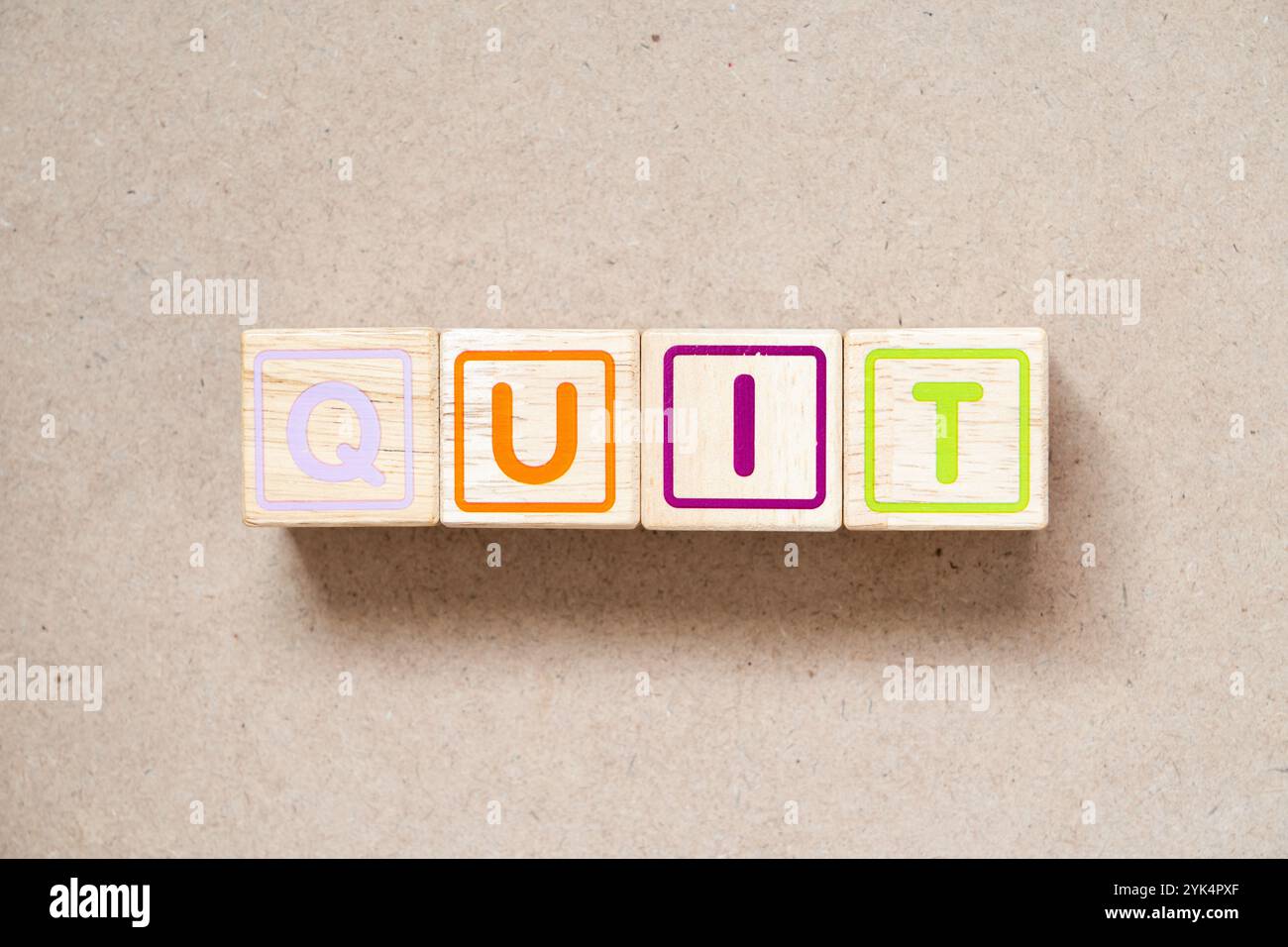 Alphabet letter block in word quit on wood background Stock Photo - Alamy