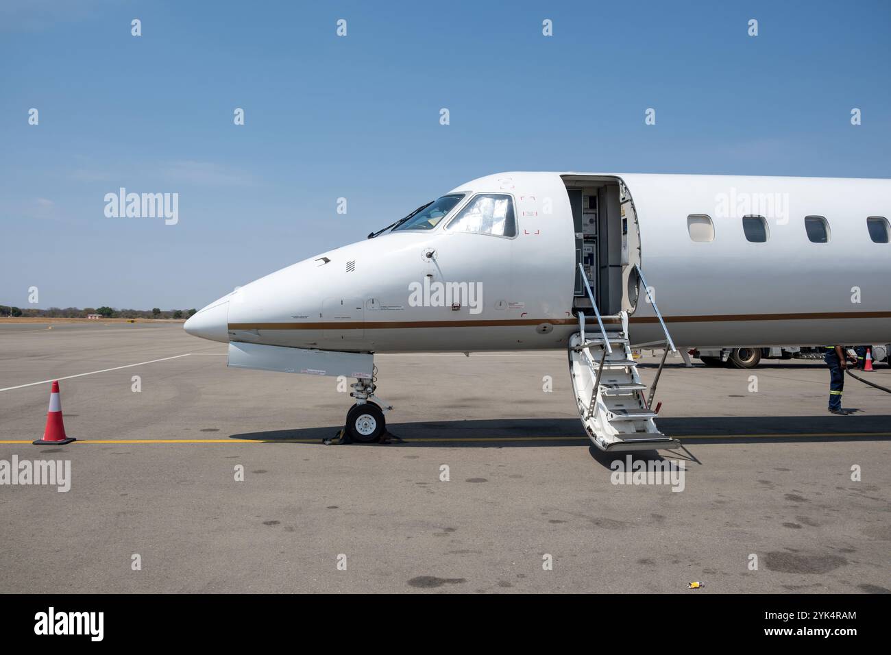 Learjet, Private Jet plane landed at Airpor runway, blue sky background ...