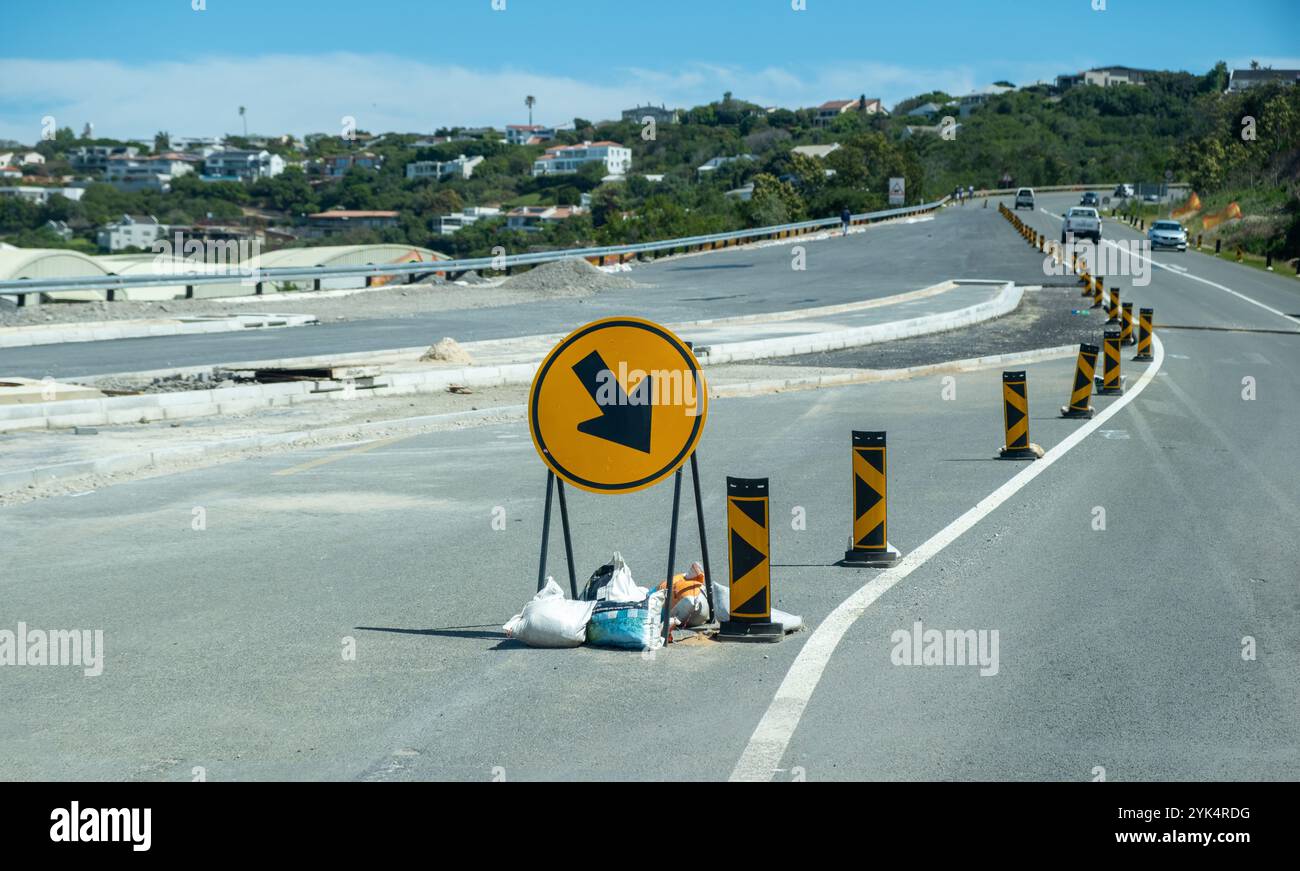 Roadworks at the highway. Warning road signs on the asphalt. Traffic ...