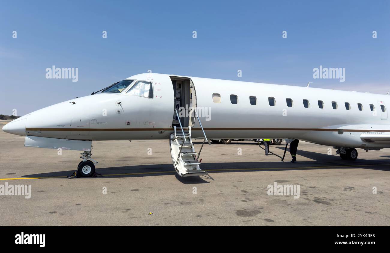 Learjet, Private Jet plane landed at Airpor runway, blue sky background ...
