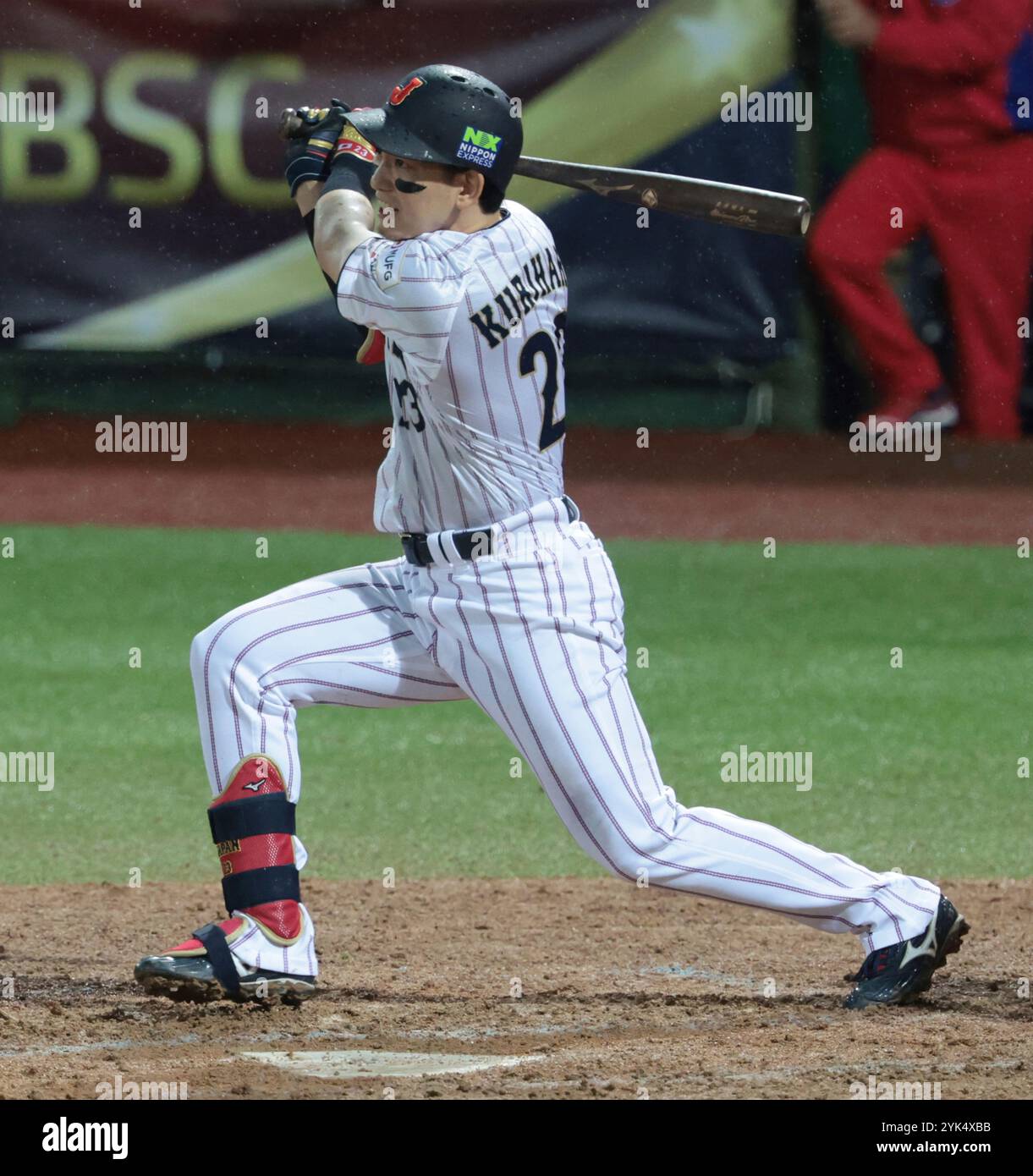 Ryoya Kurihara of Japan hits a sacrifice fly in the 8th inning of the ...