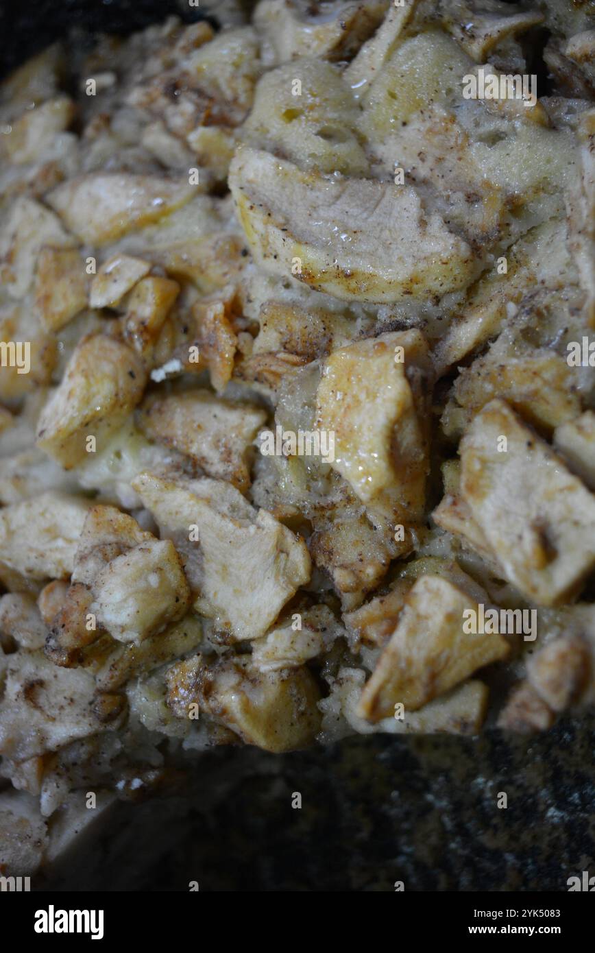 Food, cooked apple pie at home in a black heavy frying pan without ...