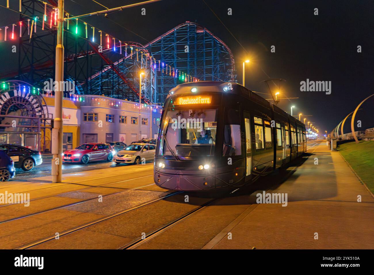 A modern tram passes Blackpool Pleasure Beach at night Stock Photo - Alamy