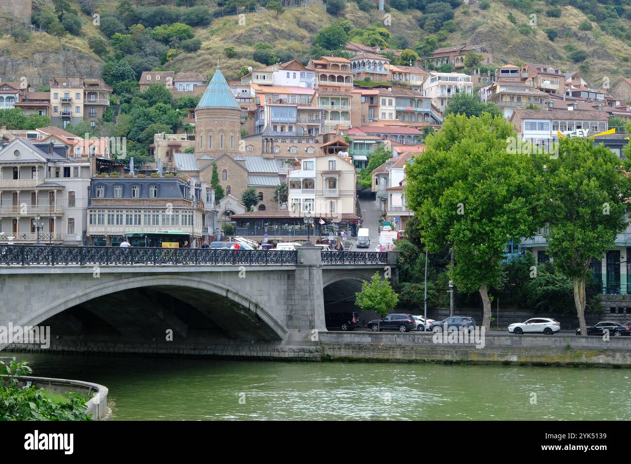 Tbilisi Old Town clings to the slopes above the Metekhi Bridge over the ...