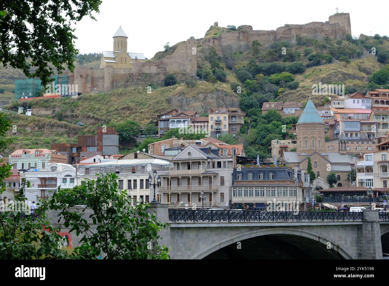 Tbilisi Old Town clings to the slopes above the Metekhi Bridge over the ...