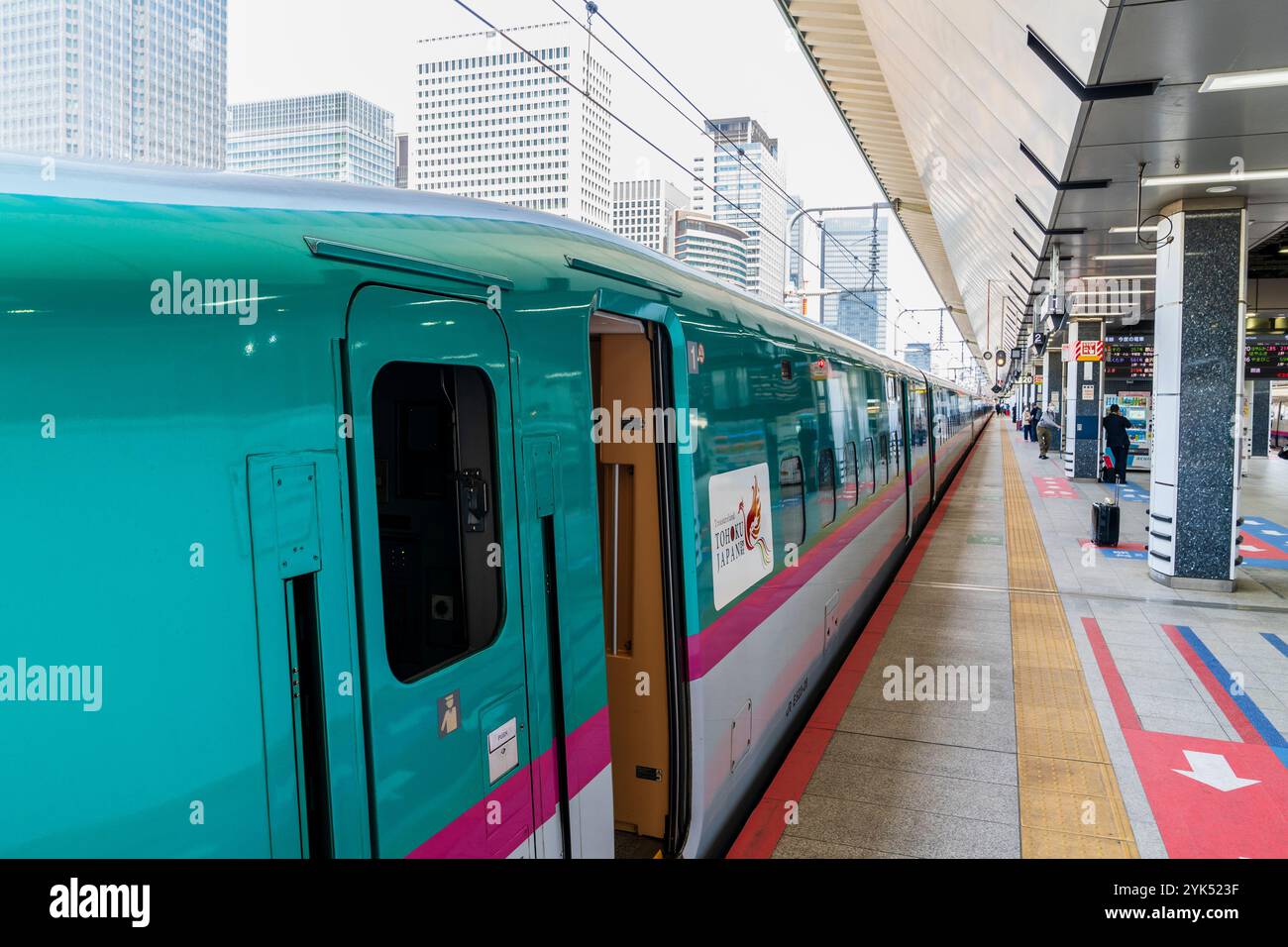 View along an E5 series Tohoku Shinkansen bullet train at the platform ...